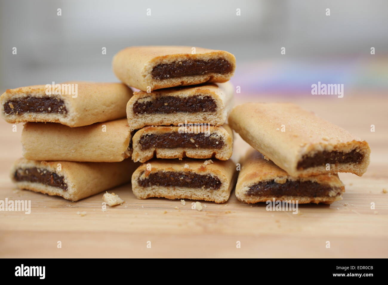 Stack of original fig newtons on a wooden cutting board Stock Photo - Alamy