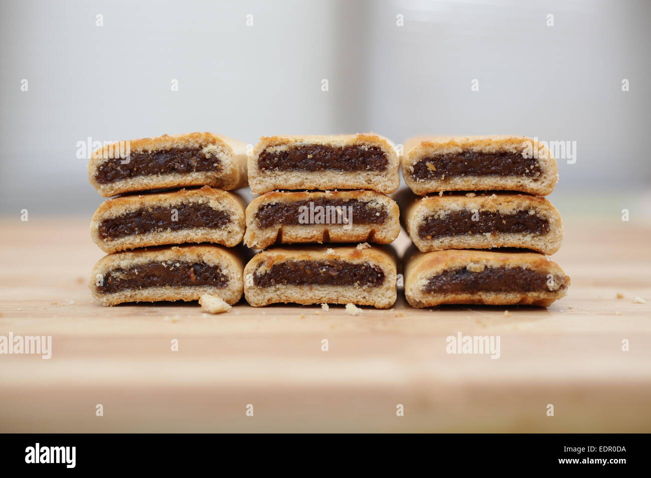 stack of figs newtons on a wooden cutting board Stock Photo - Alamy