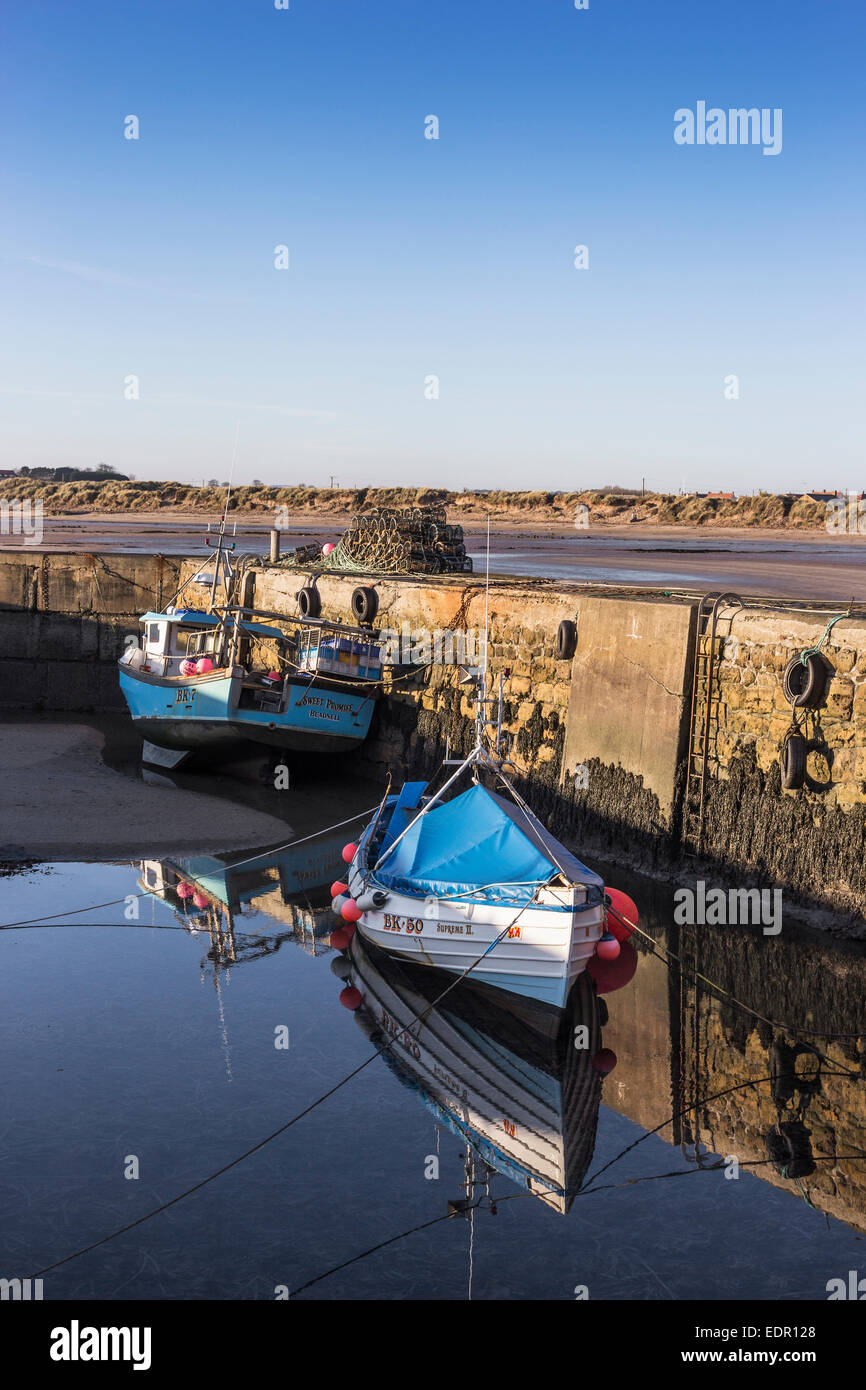 Fishing boats in Beadnell harbour, the only west facing harbour on the ...