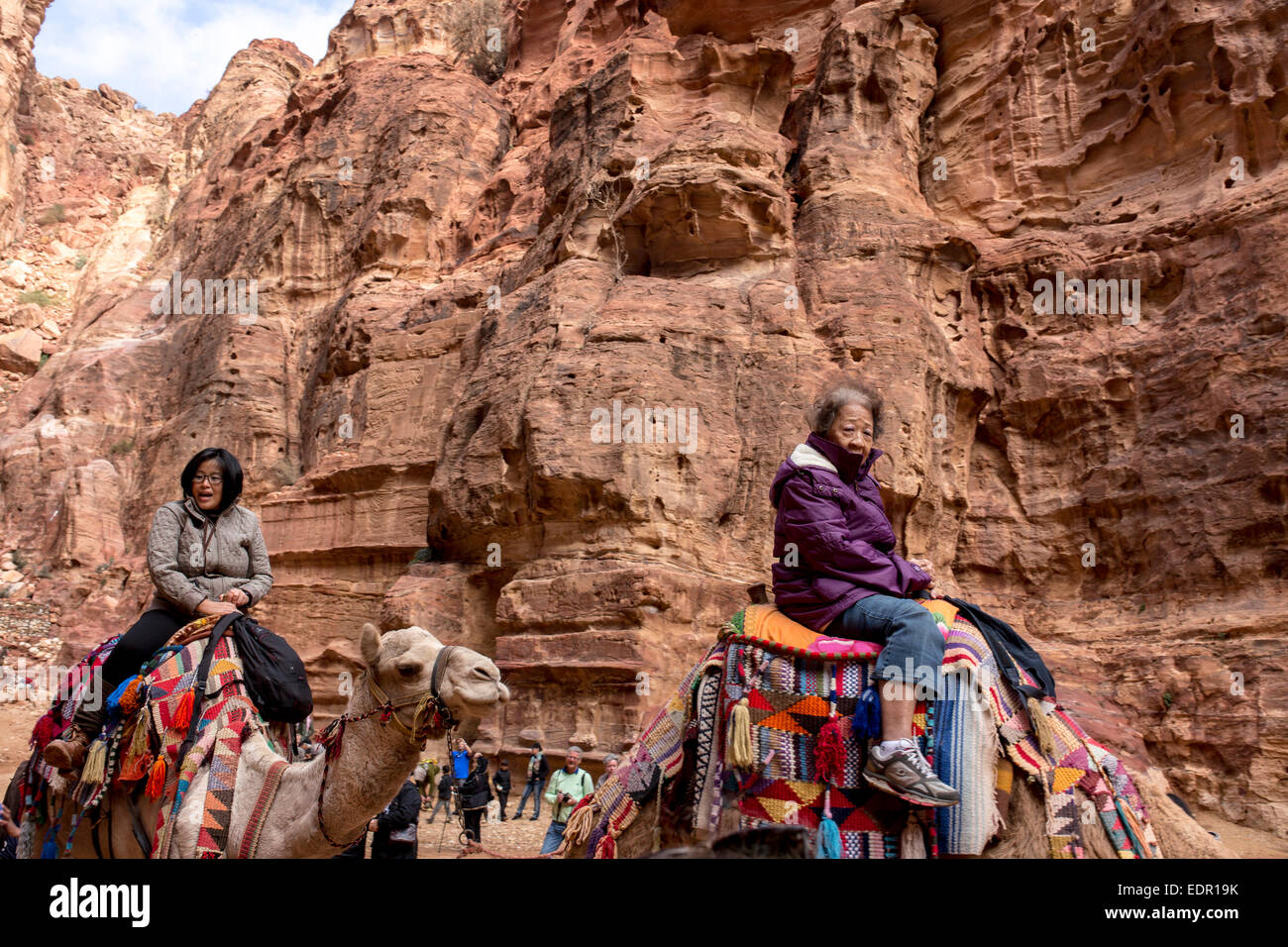 Riding camel in Petra, Jordan Stock Photo - Alamy