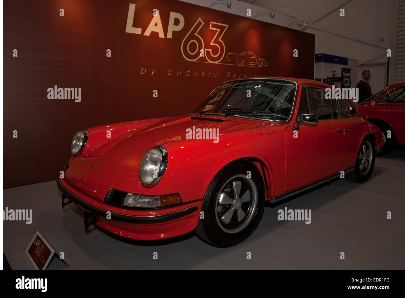 An orange Porsche on show at the London Classic car show Excel Stock ...