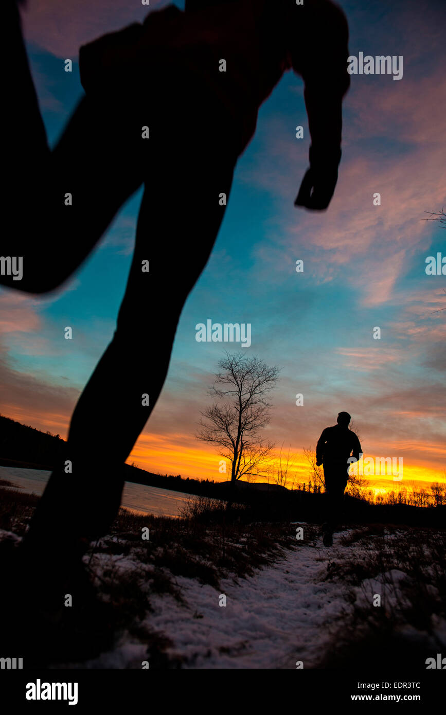 Running at sunrise hi-res stock photography and images - Alamy