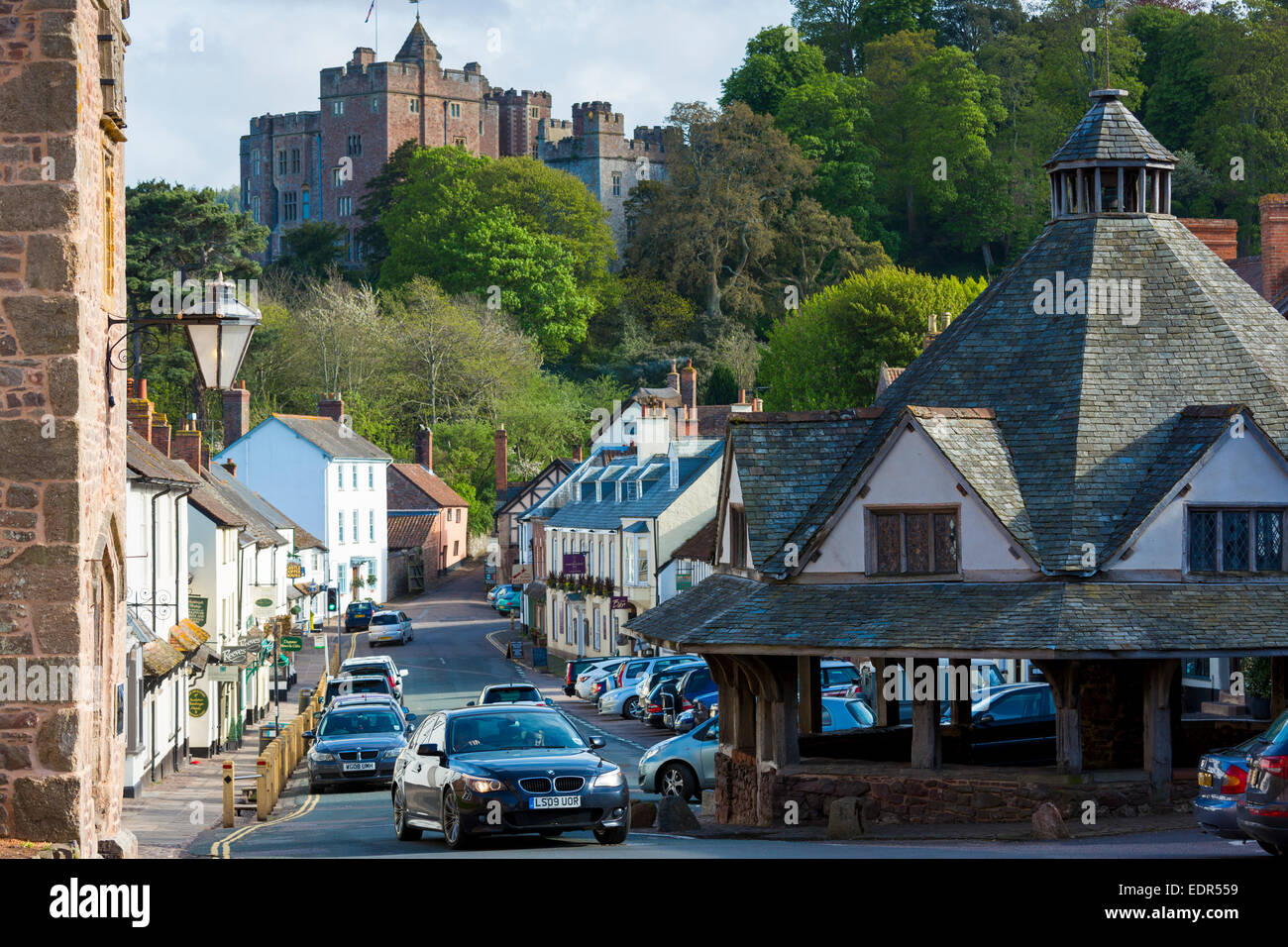 Motoring in a BMW saloon car through the old town of Dunster, Dunster ...