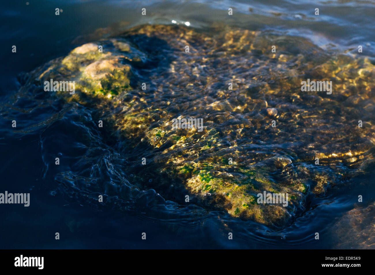 A rock with water running over it Stock Photo - Alamy