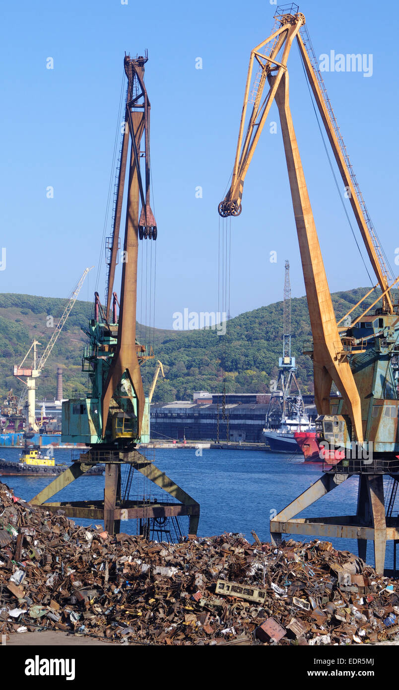 Recycling, loading scrap metal in the ship. Russia. Port of Nakhodka ...