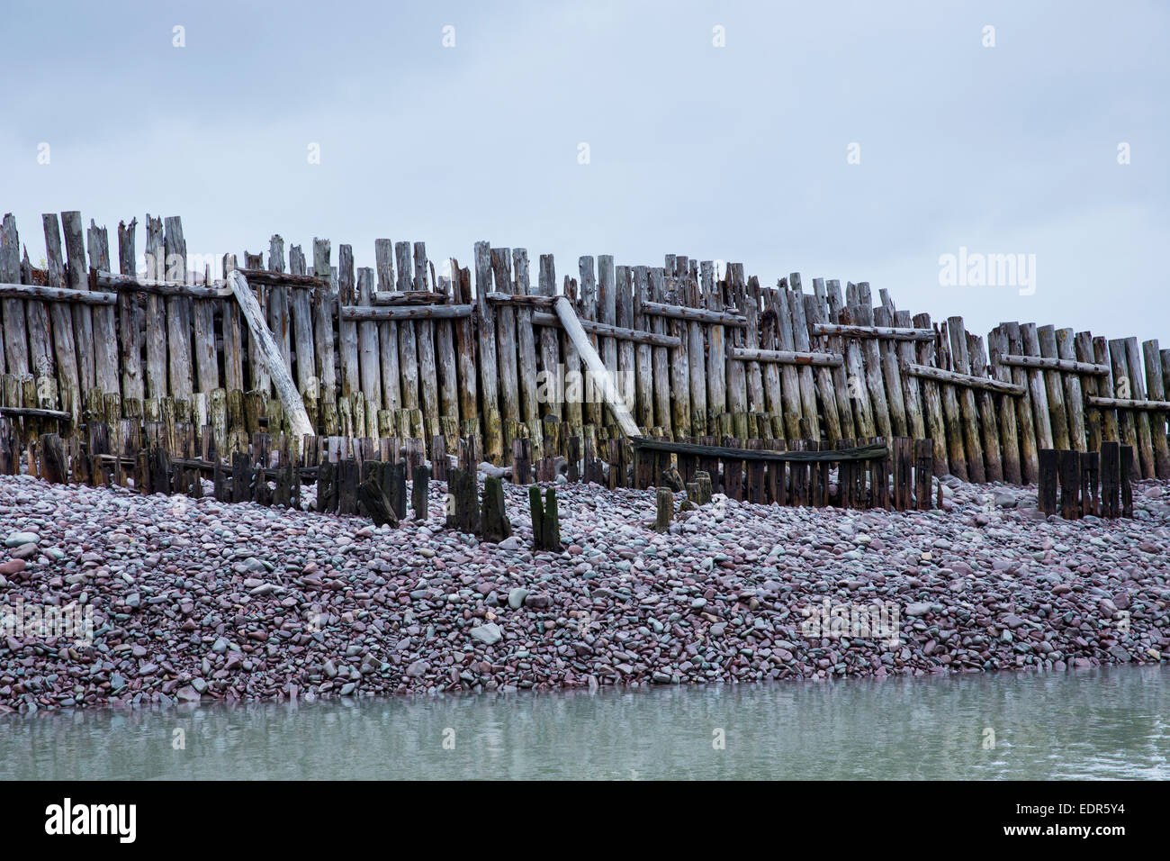 Timber groynes constructed to stop erosion ( groines ) of sand and ...