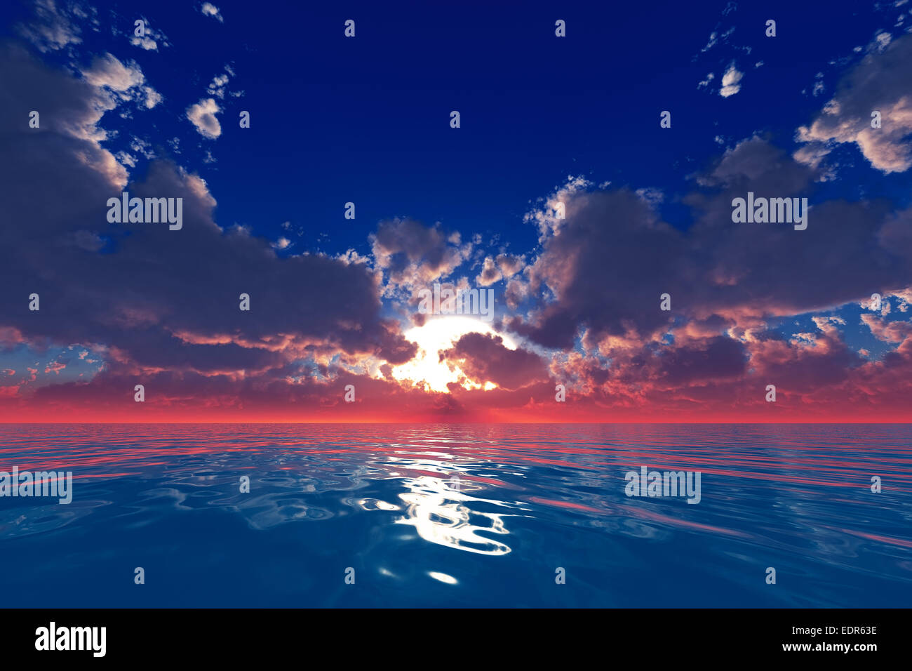 big sun with rays in clouds over calm ocean sunset Stock Photo - Alamy