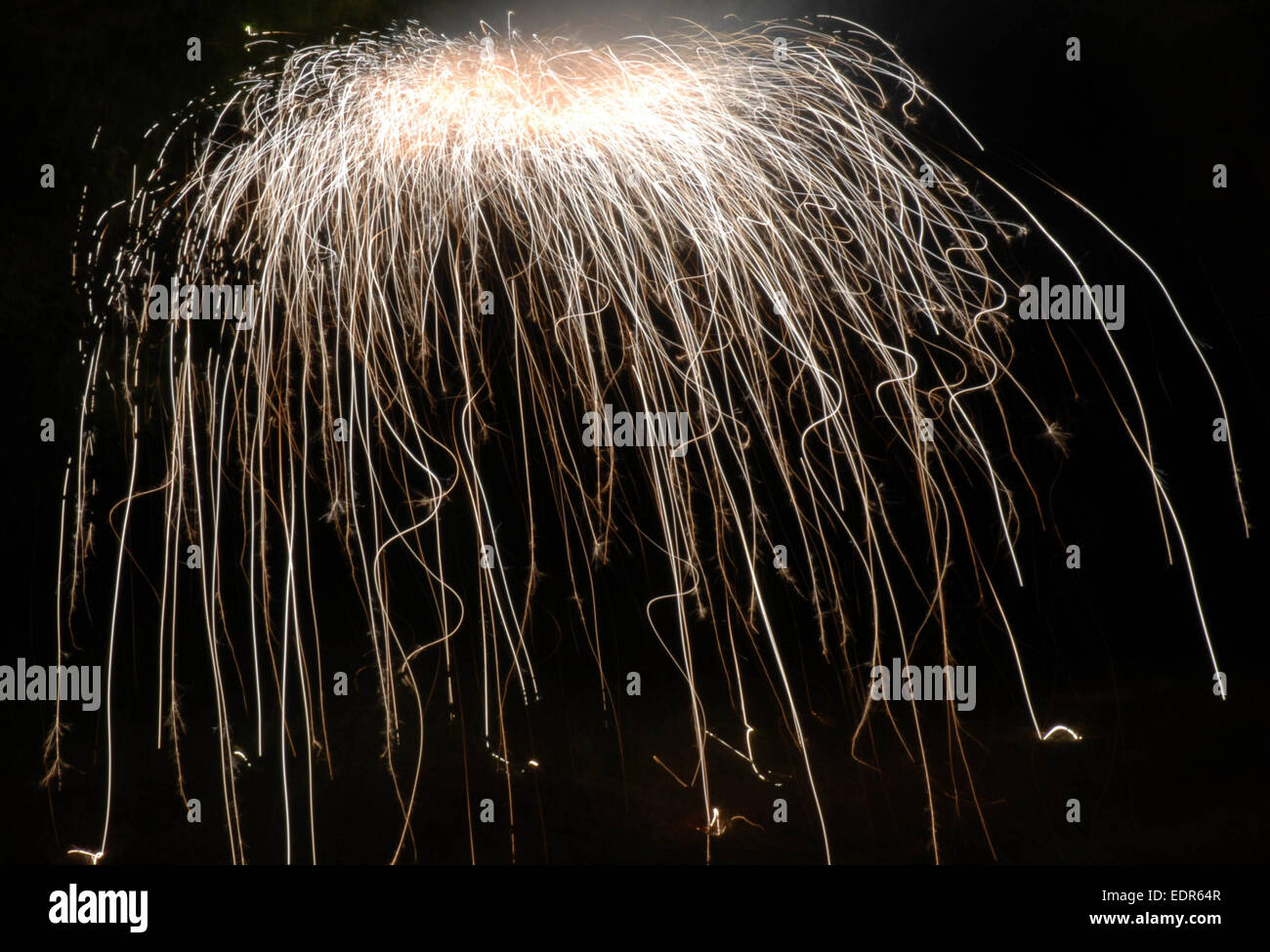 Long exposure of shower of sparks from a Chinese lantern firework at ...