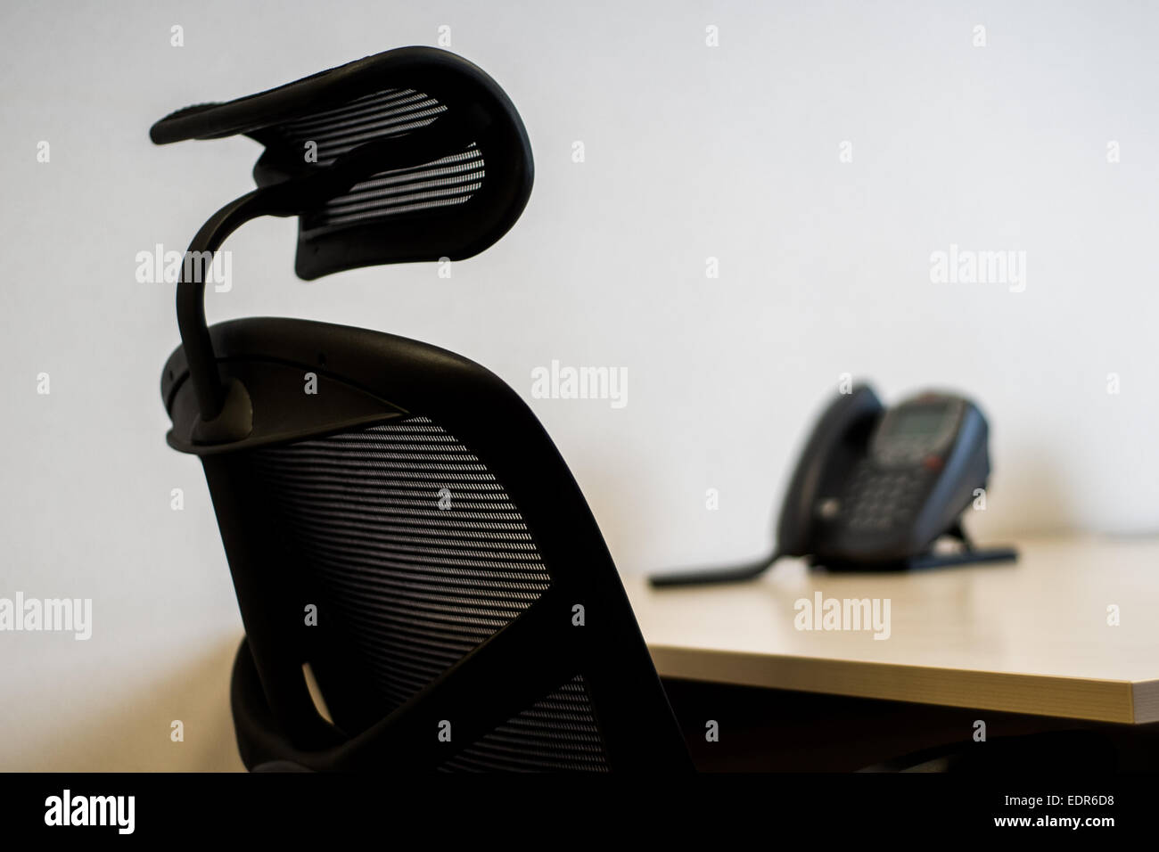 Office chair with telephone on desk in the background Stock Photo - Alamy