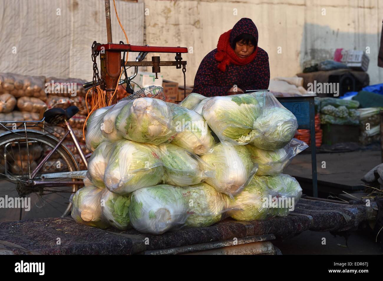 Taiyuan, China's Shanxi Province. 9th Jan, 2015. A vegetable dealer ...