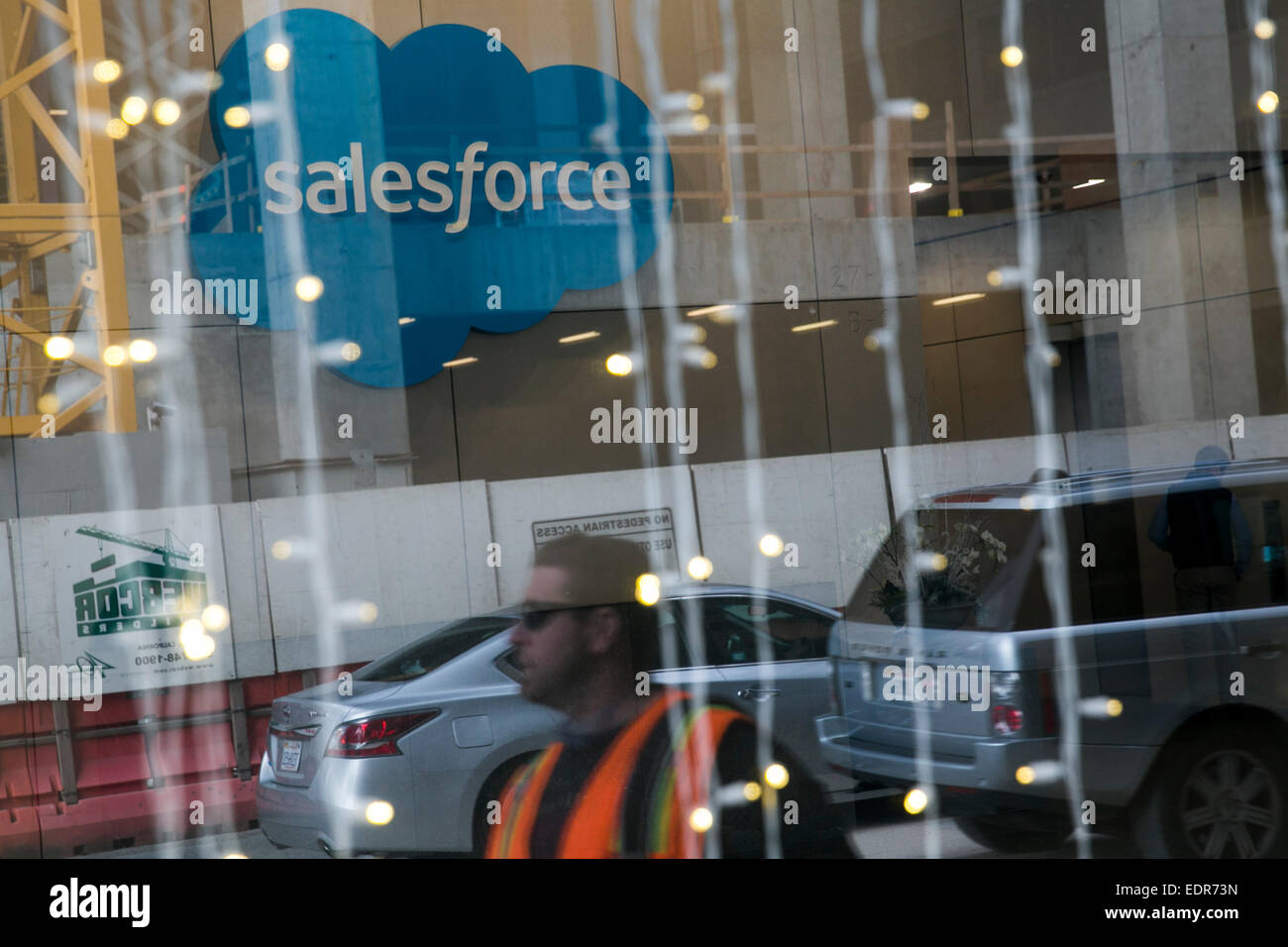 A Salesforce, Inc., logo sign seen through a window in downtown San ...