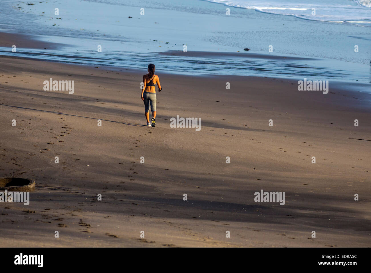 Running on the beach in Bali, Indonesia Stock Photo - Alamy