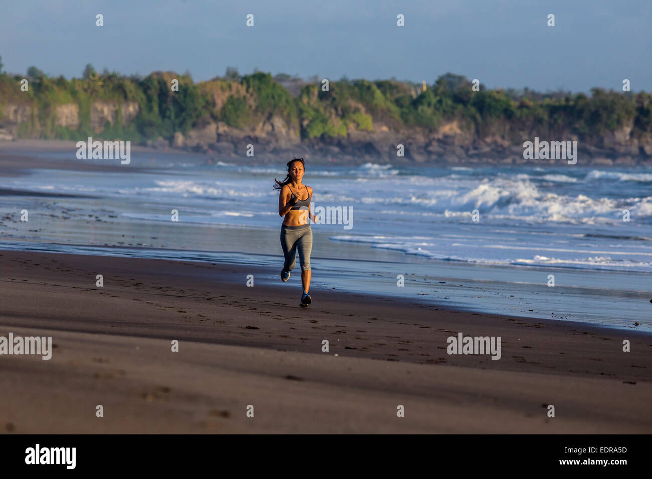 Running on the beach in Bali, Indonesia Stock Photo - Alamy