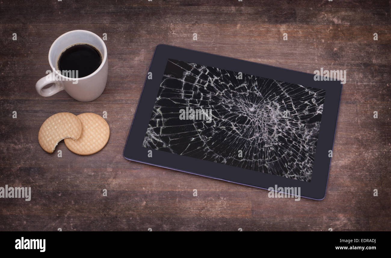 Tablet computer with broken glass, screen destroyed Stock Photo - Alamy