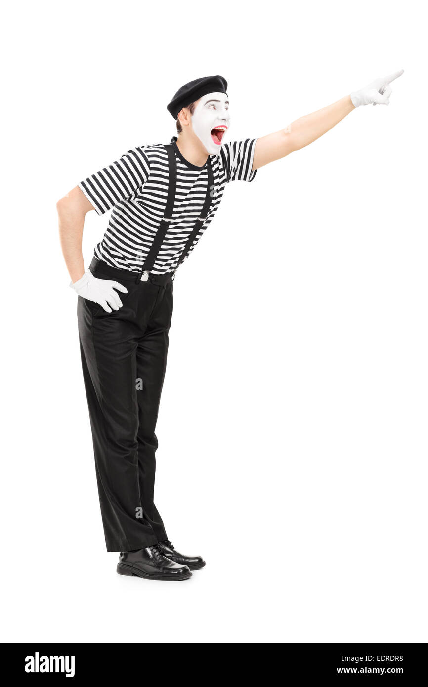 Full length portrait of a mime artist pointing up with his hand ...