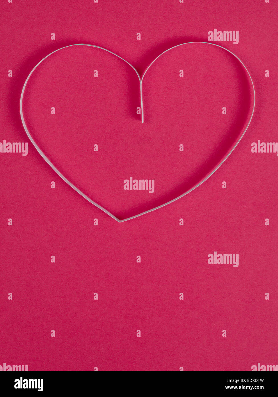 paper heart on pink paper background Stock Photo - Alamy