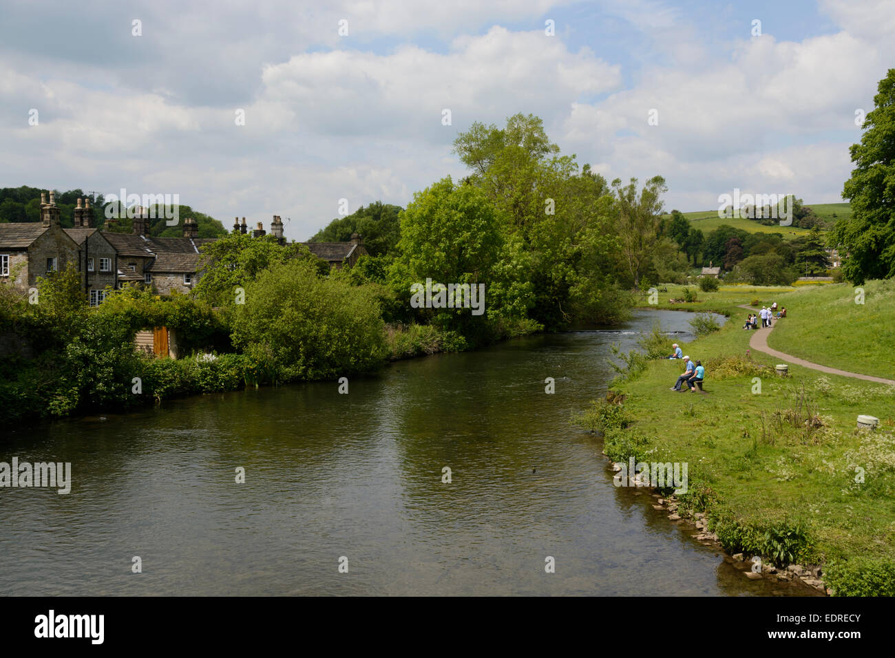 People relaxing along the River Wye in Bakewell Derbyshire Peak ...