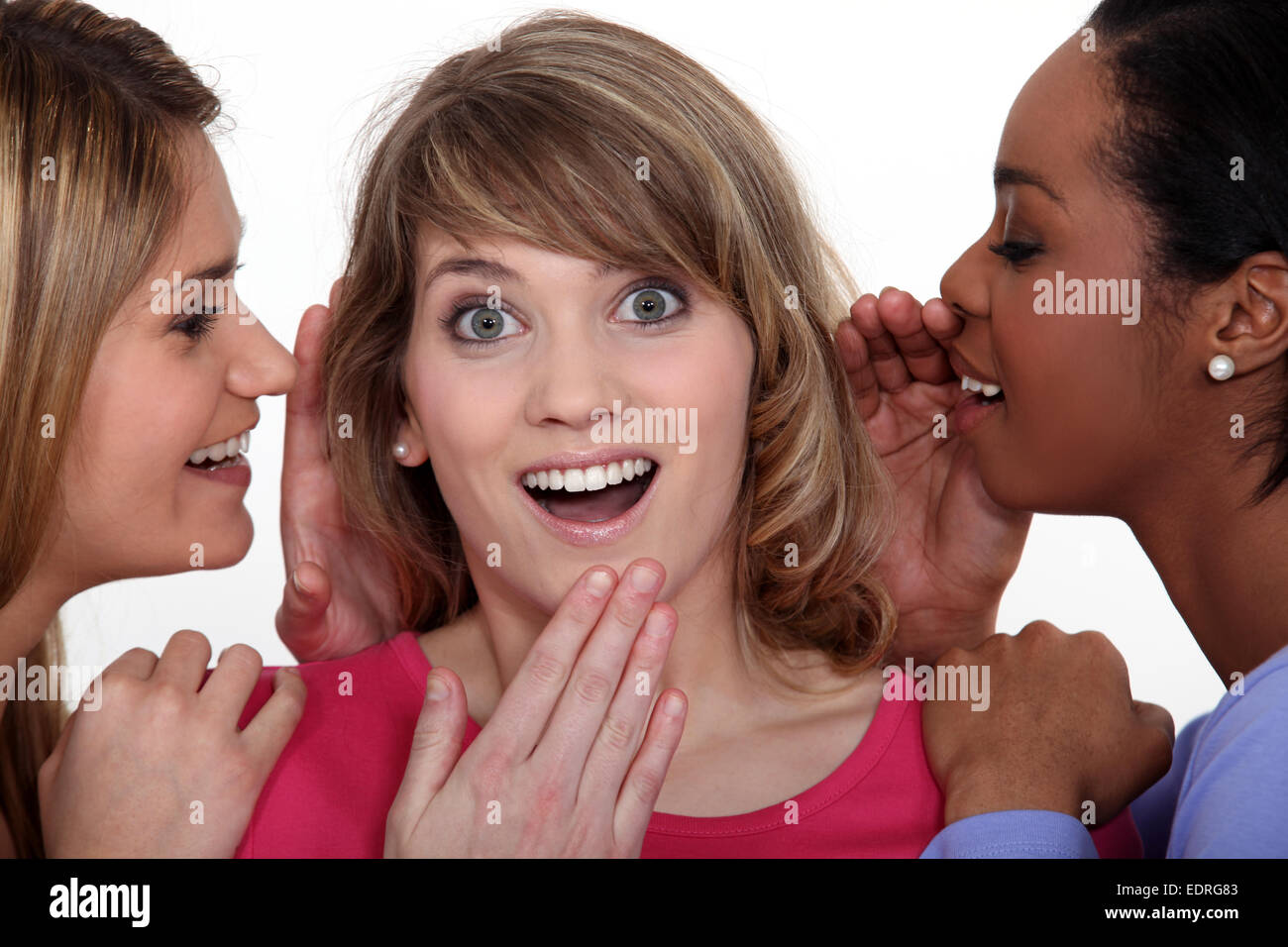 Three girls whispering hi-res stock photography and images - Alamy