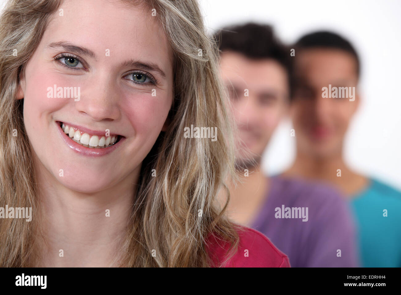 Three happy successful classmates hi-res stock photography and images ...