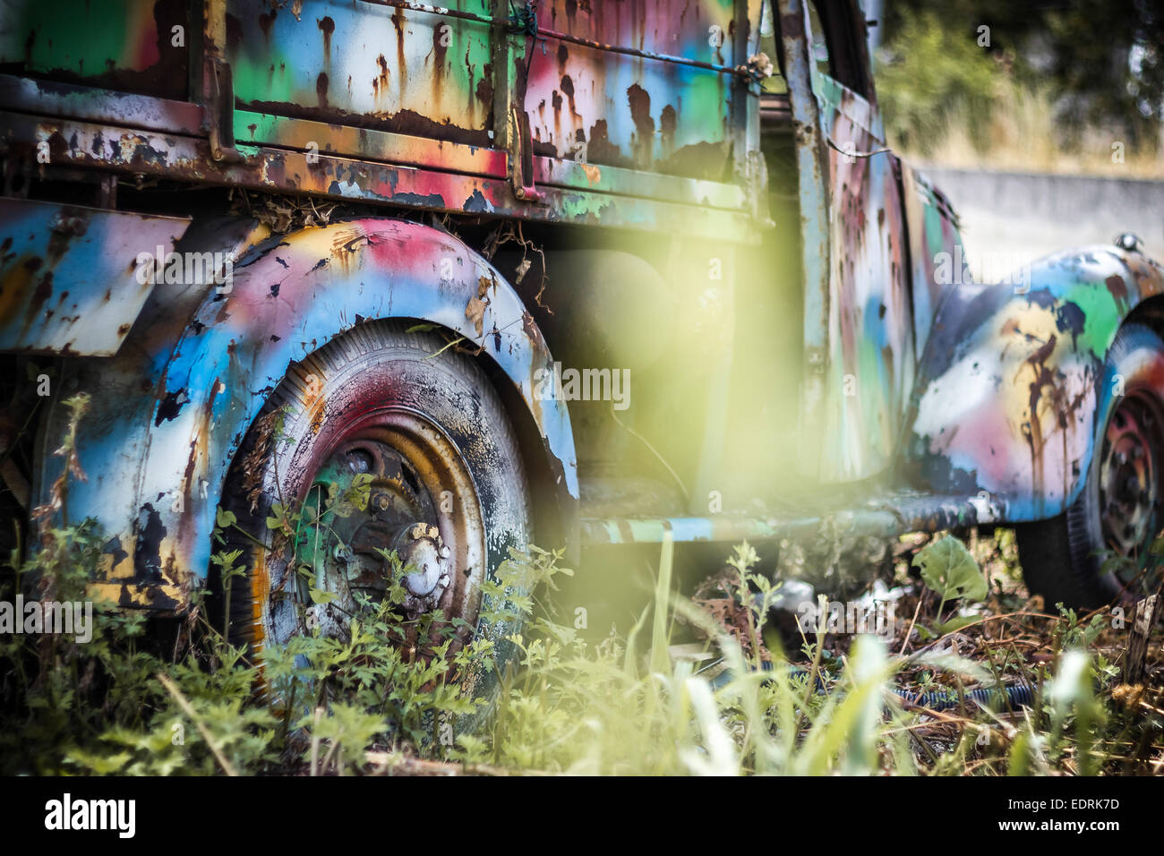 The wreckage of a truck painted with bright colors Stock Photo - Alamy