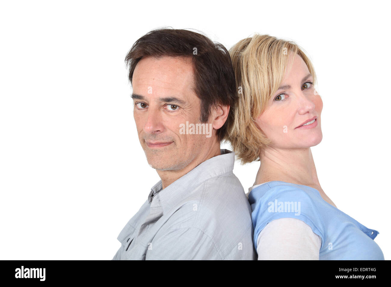 Couple back to back Stock Photo - Alamy