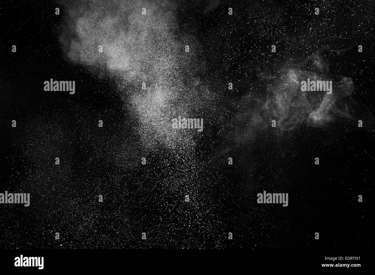 abstract white powder explosion on black background Stock Photo - Alamy