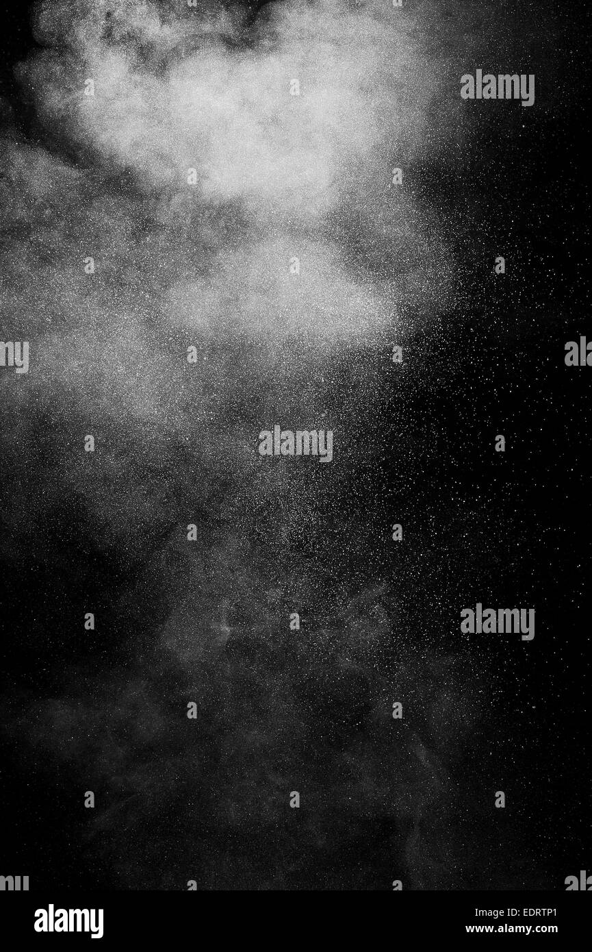 abstract white powder explosion on black background Stock Photo - Alamy