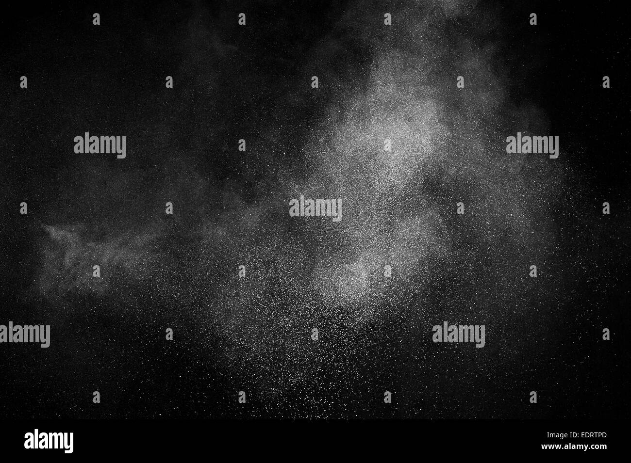 abstract white powder explosion on black background Stock Photo - Alamy