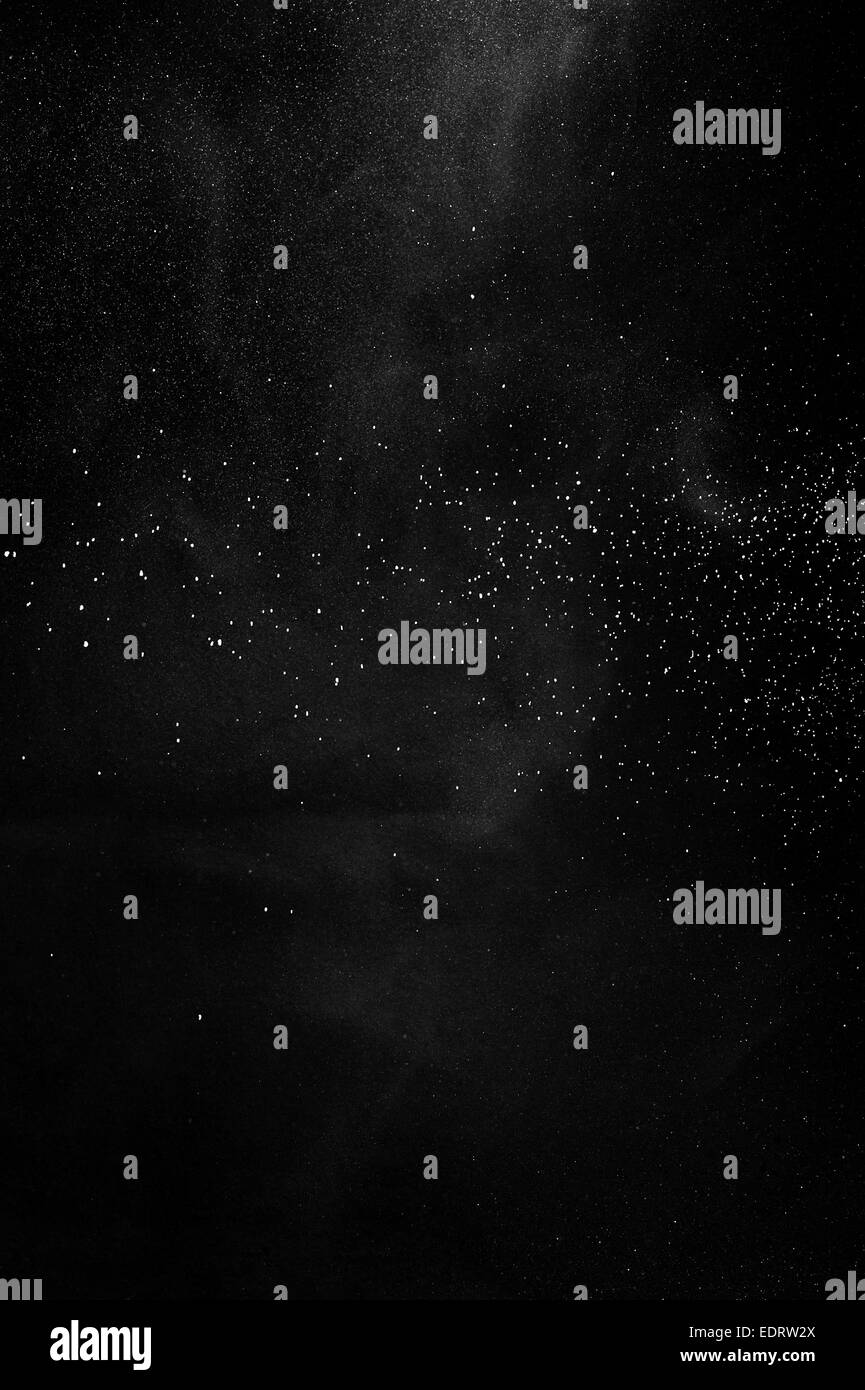 abstract white powder explosion on black background Stock Photo - Alamy