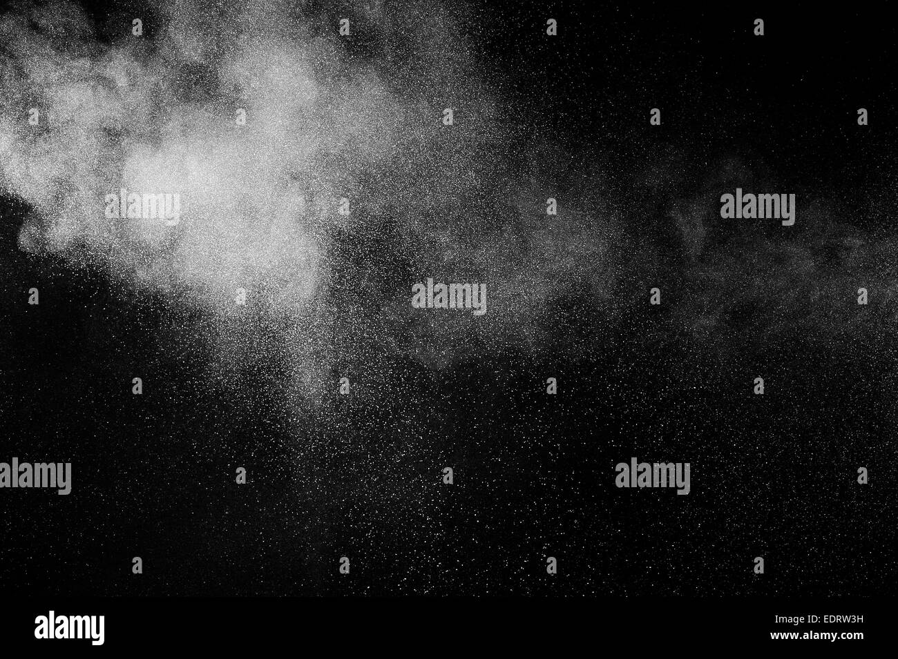 abstract white powder explosion on black background Stock Photo - Alamy