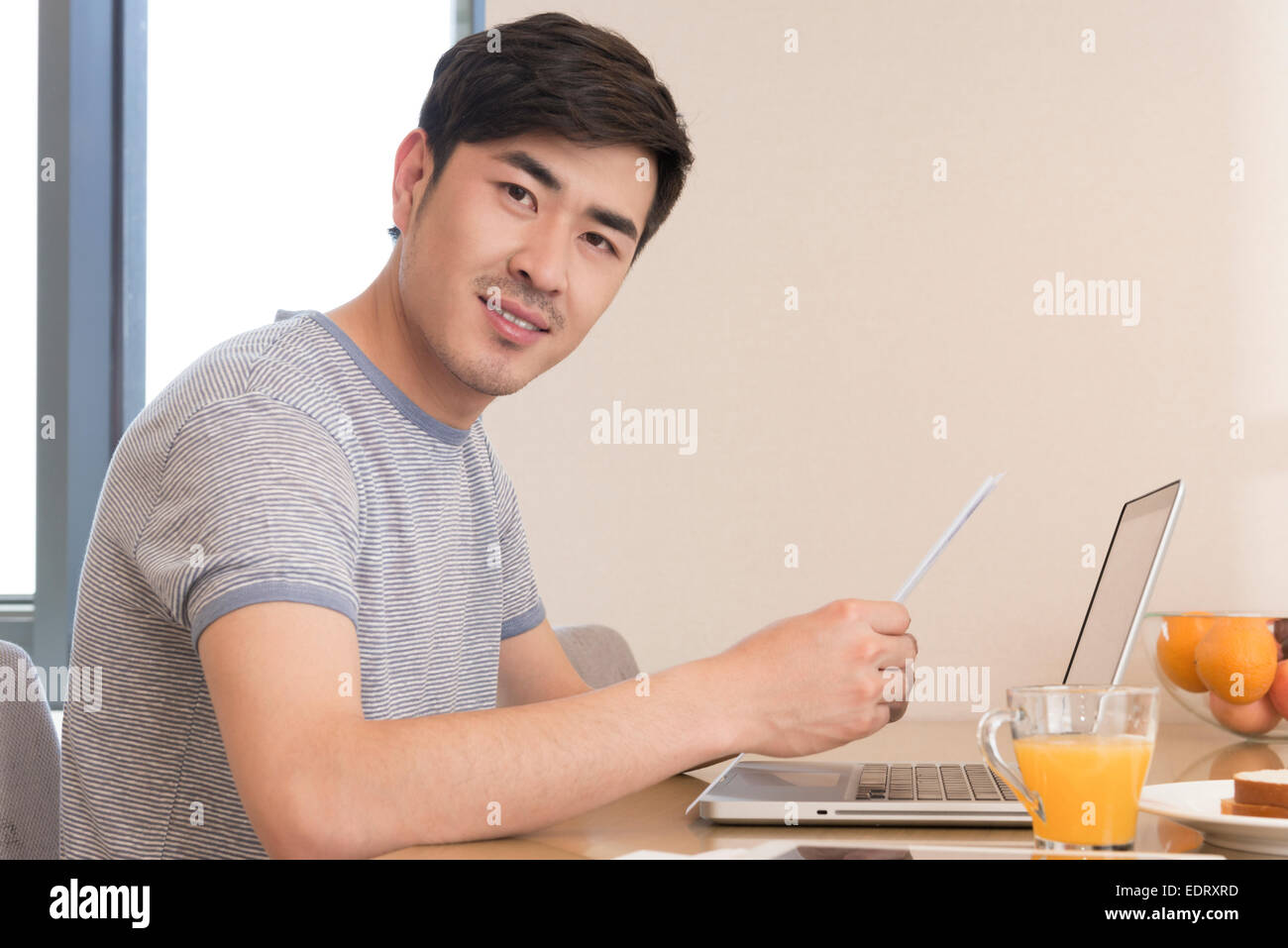 Asian eating breakfast at hotel hi-res stock photography and images - Alamy