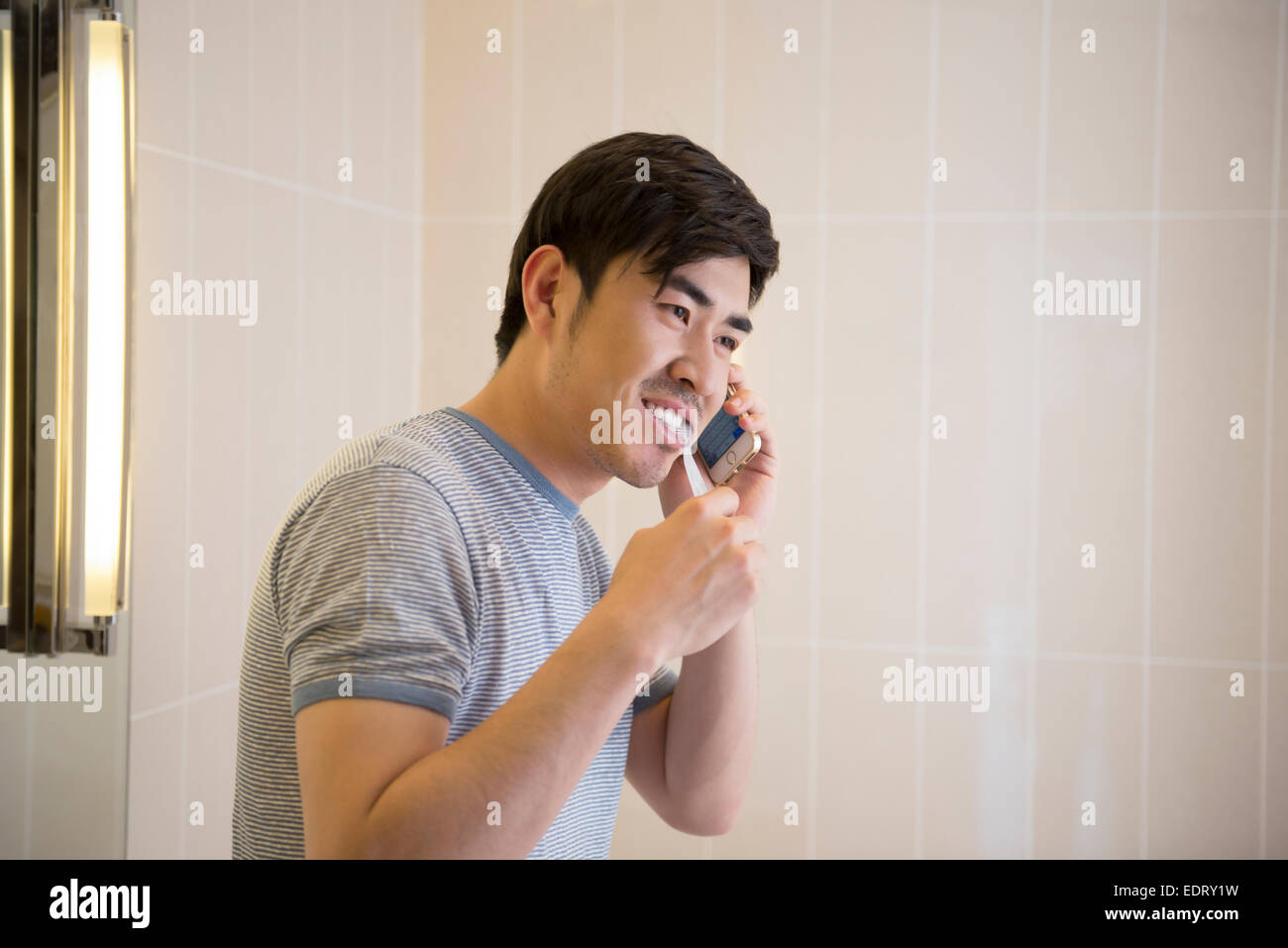 Man phone bathroom hi-res stock photography and images - Alamy