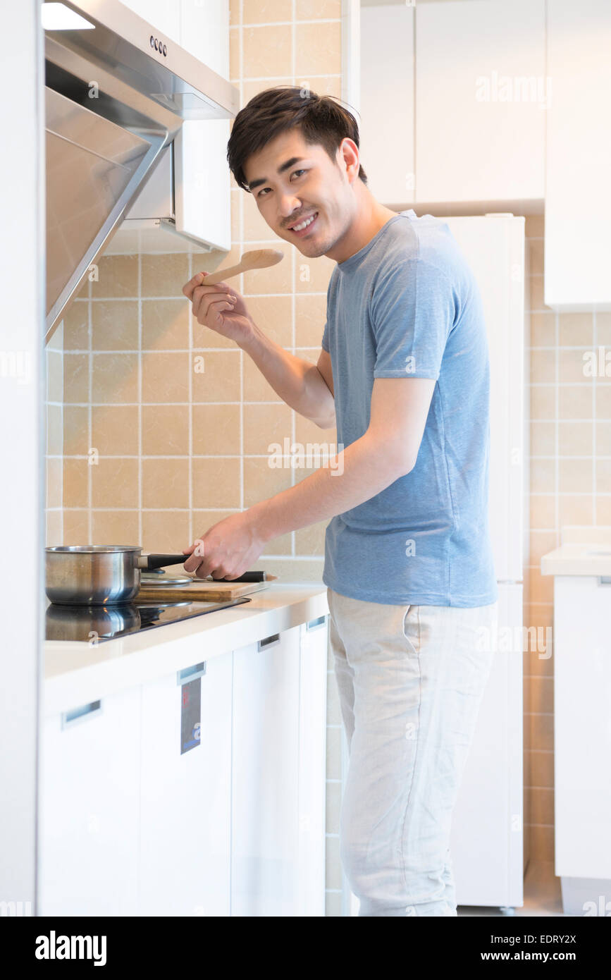 Man cooking food in pot hi-res stock photography and images - Alamy