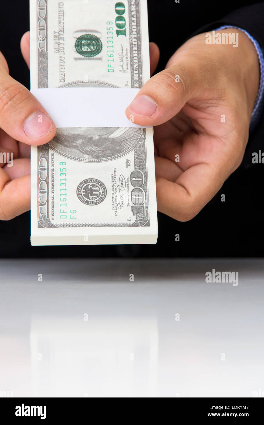 Hand giving money concept Stock Photo - Alamy