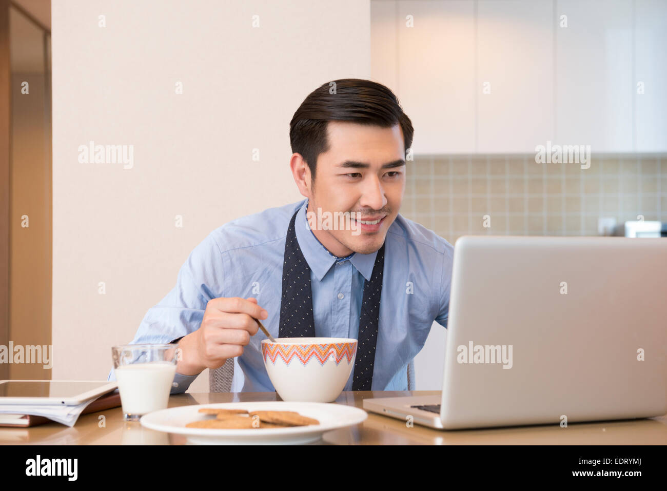 Man eating and working with laptop hi-res stock photography and images ...