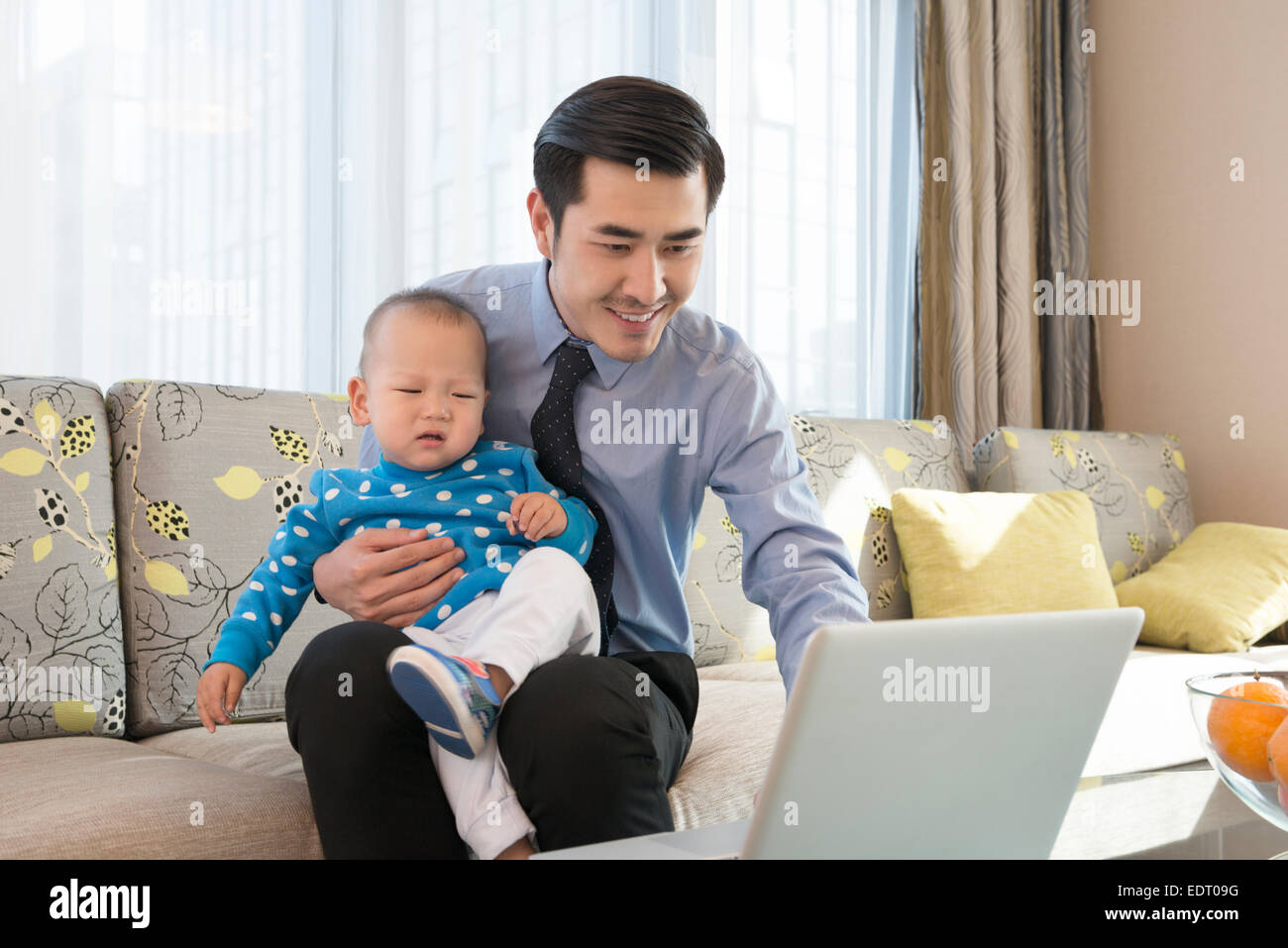 Busy father baby chinese hi-res stock photography and images - Alamy