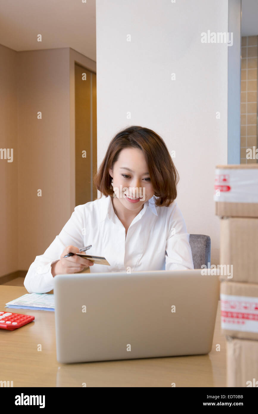 Online seller using laptop Stock Photo - Alamy