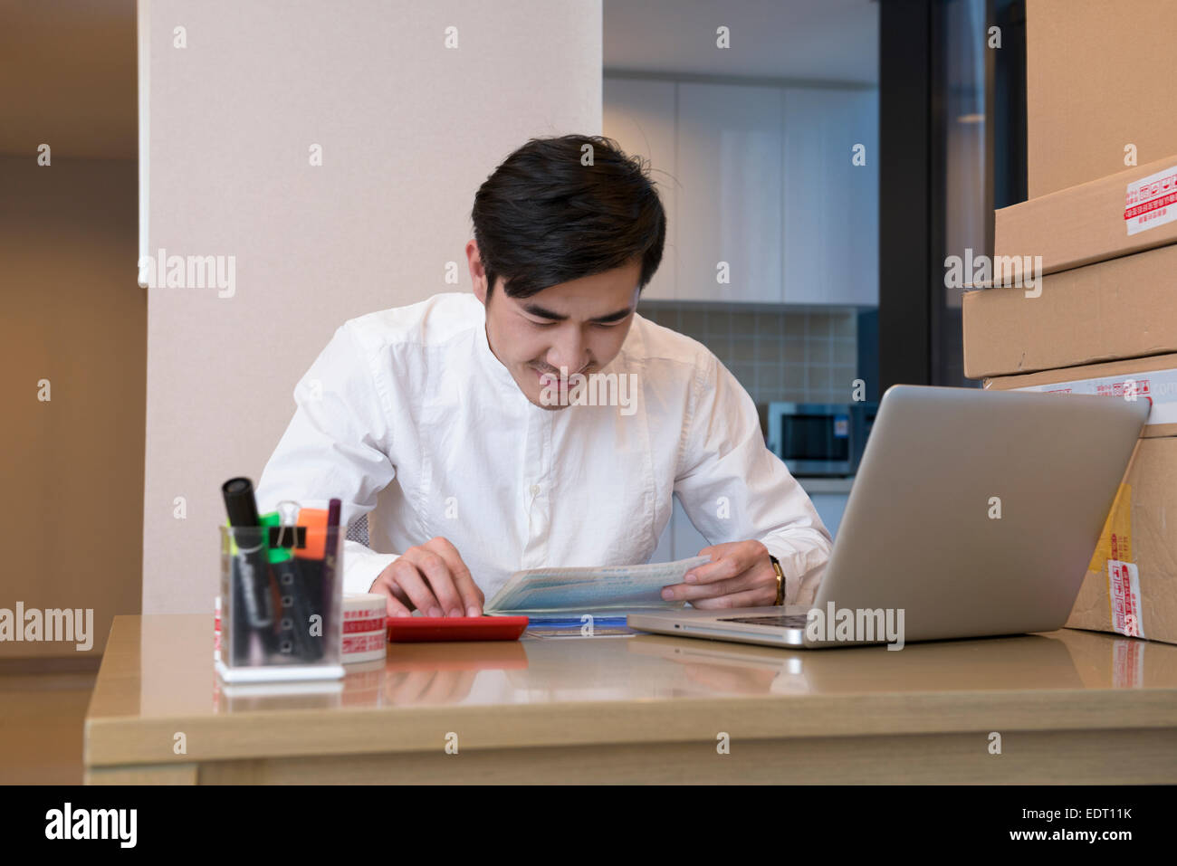 Online seller using laptop Stock Photo - Alamy