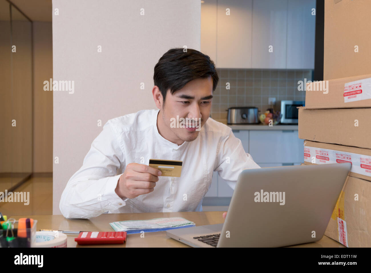 Online seller using laptop Stock Photo - Alamy