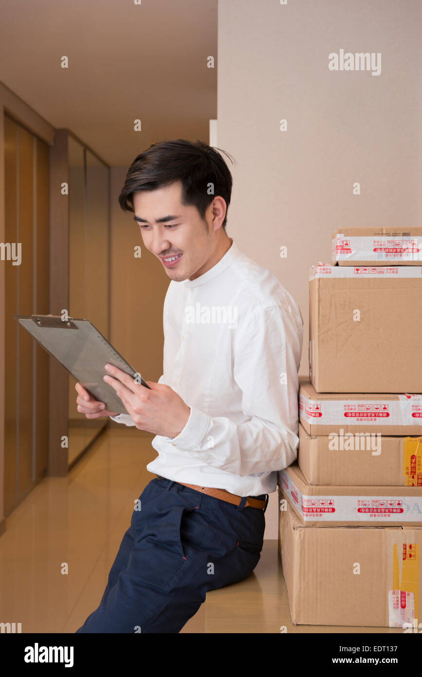 Online seller with boxes for shipping Stock Photo - Alamy
