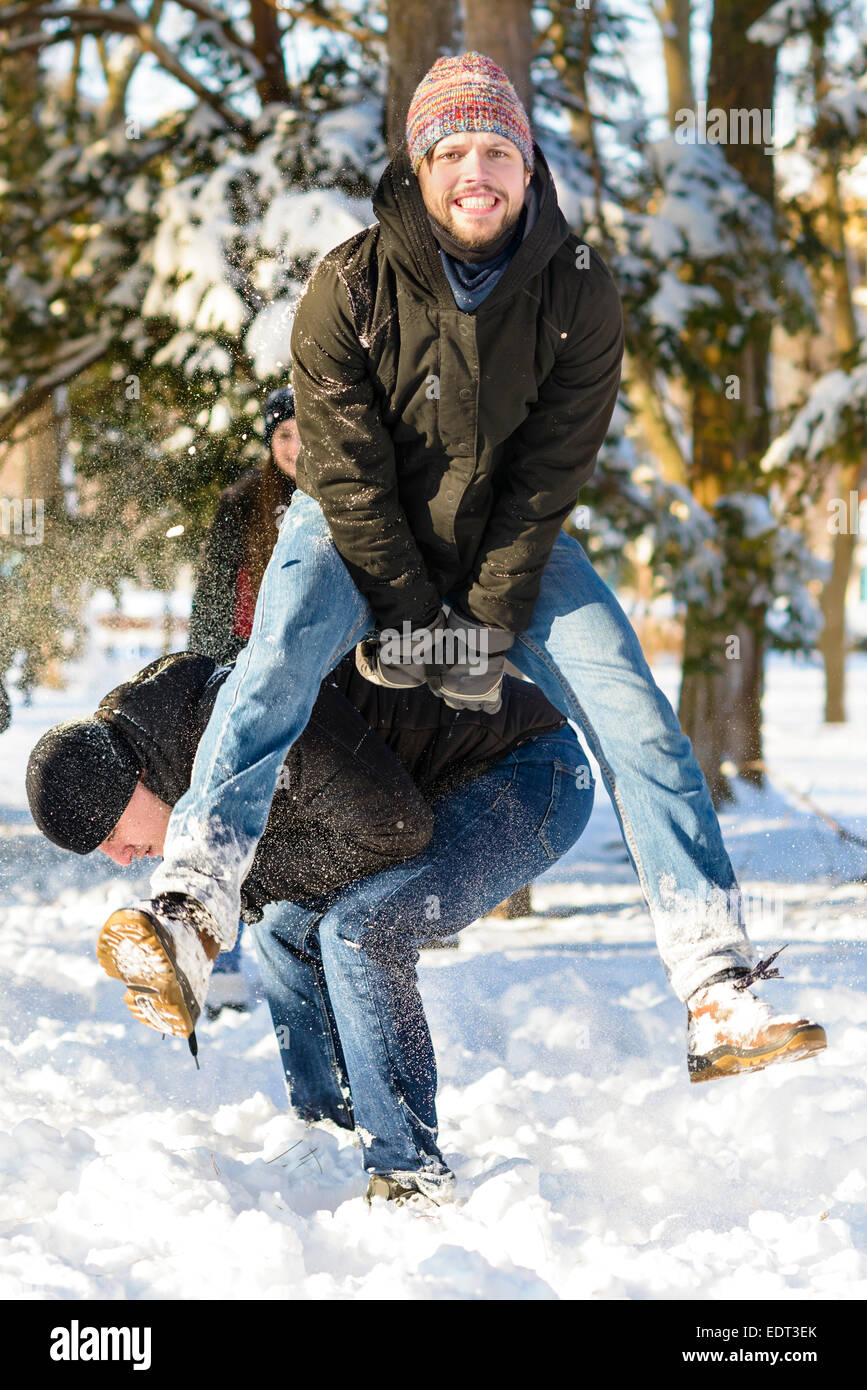 Jumping over another person (Goat) winter time Stock Photo - Alamy