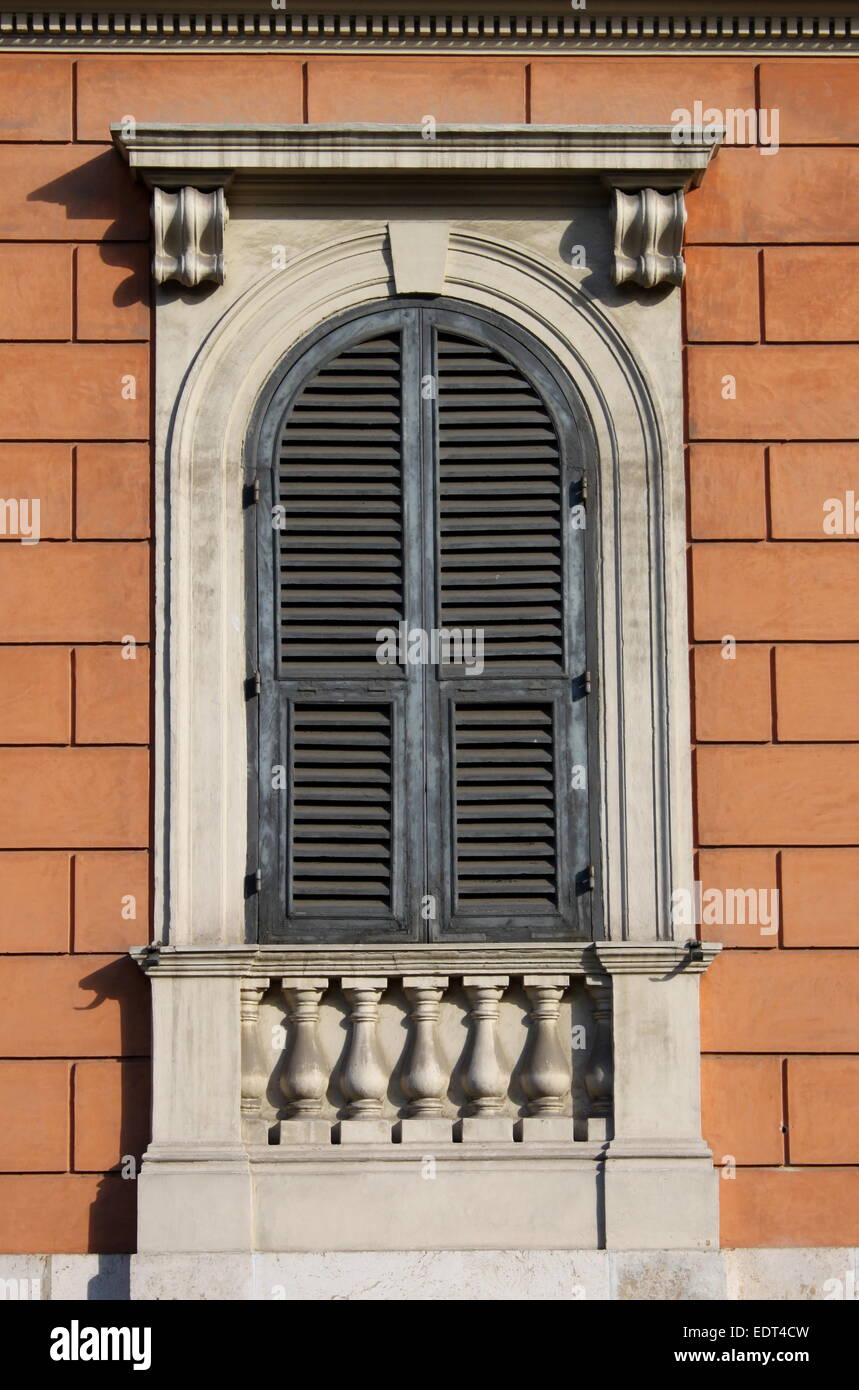 Detailed view of an arched window with closed jalousies Stock Photo - Alamy