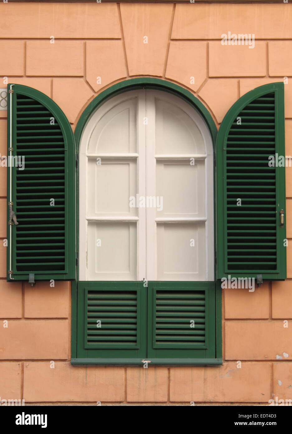 Renaissance window with arch and open shutters Stock Photo - Alamy