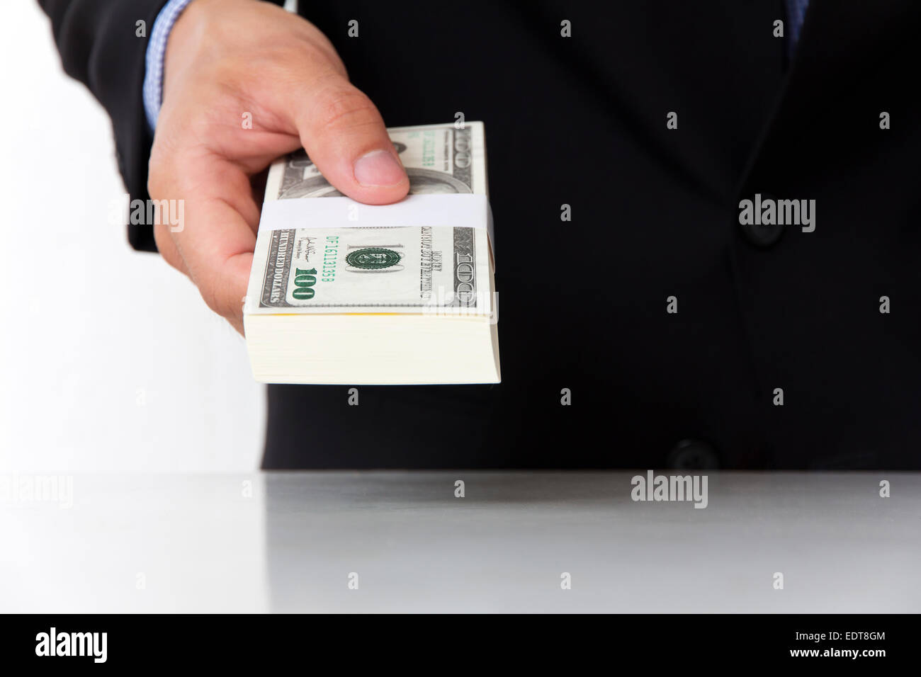 Hand giving money Stock Photo - Alamy