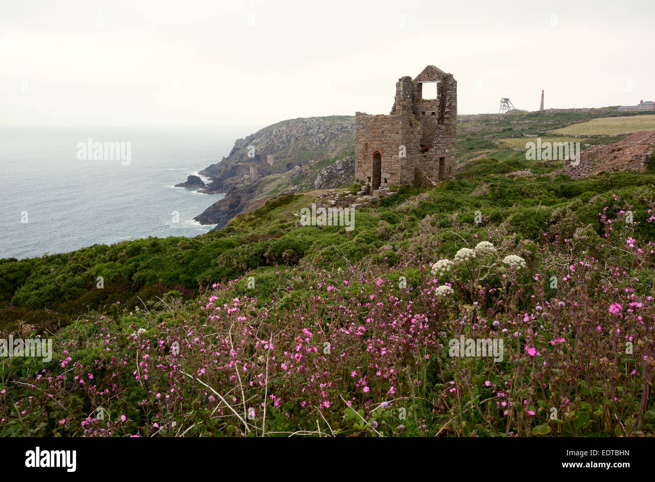 A derelict engine house at Bottallack mines on a misty summers day ...