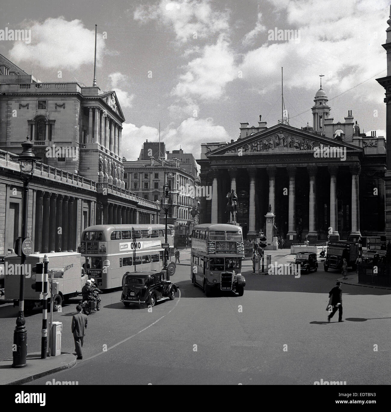 1950s historical, cars and buses at Bank, a major intersection. Seen is ...