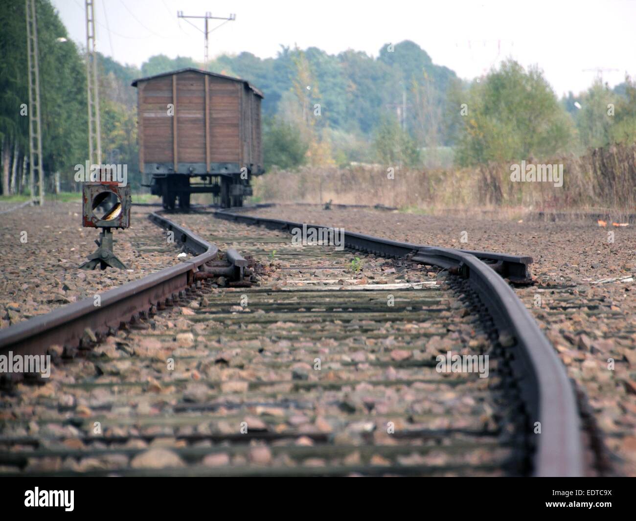 A freigh wagon stands on a side track between Auschwitz main camp and ...