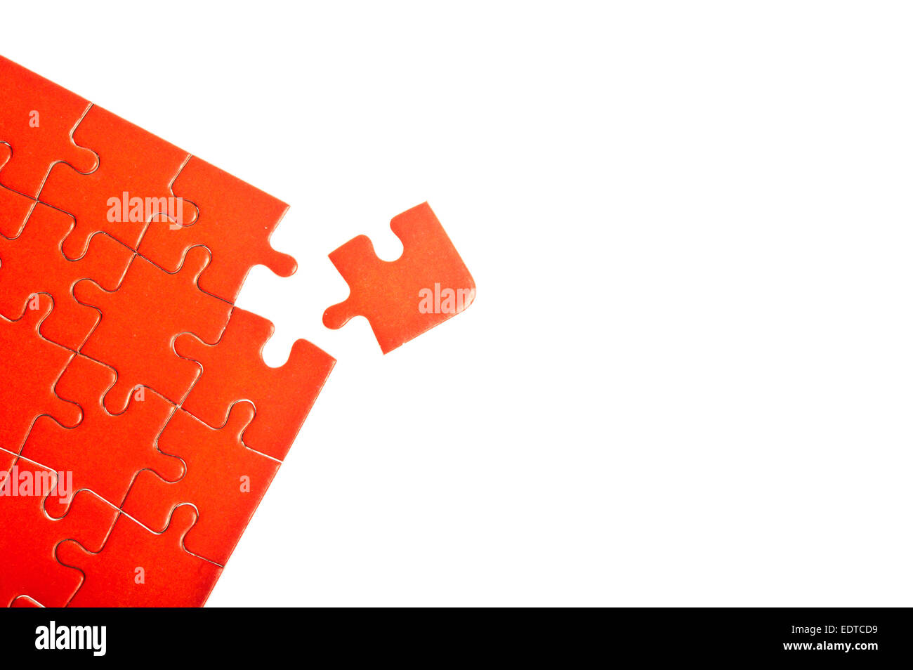 red jigsaw puzzle, one piece to finish it Stock Photo - Alamy