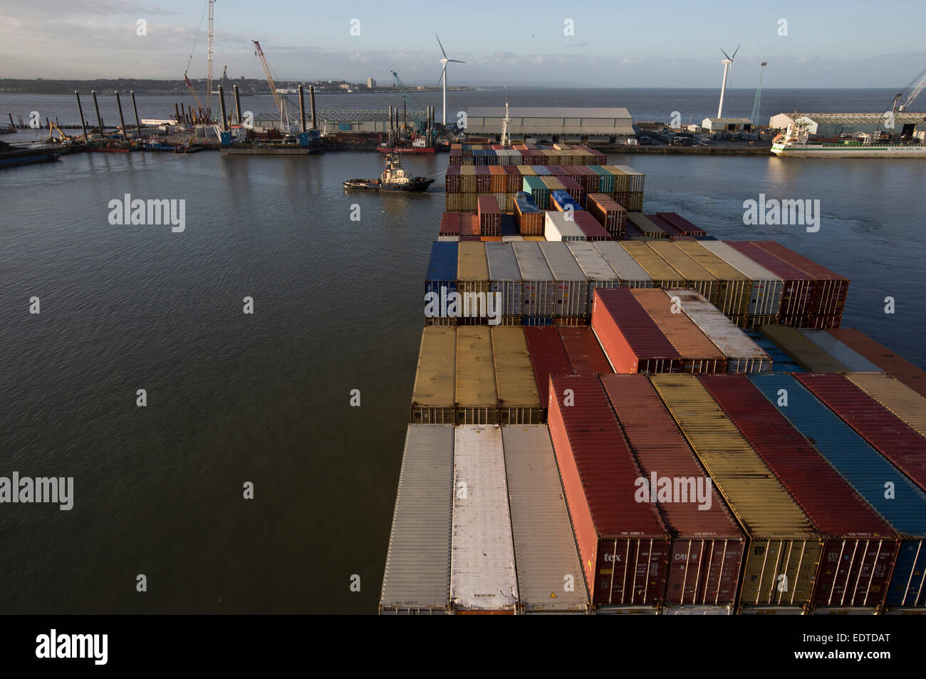 A tug pulling the Panama-registered container ship MSC Sandra, at the ...