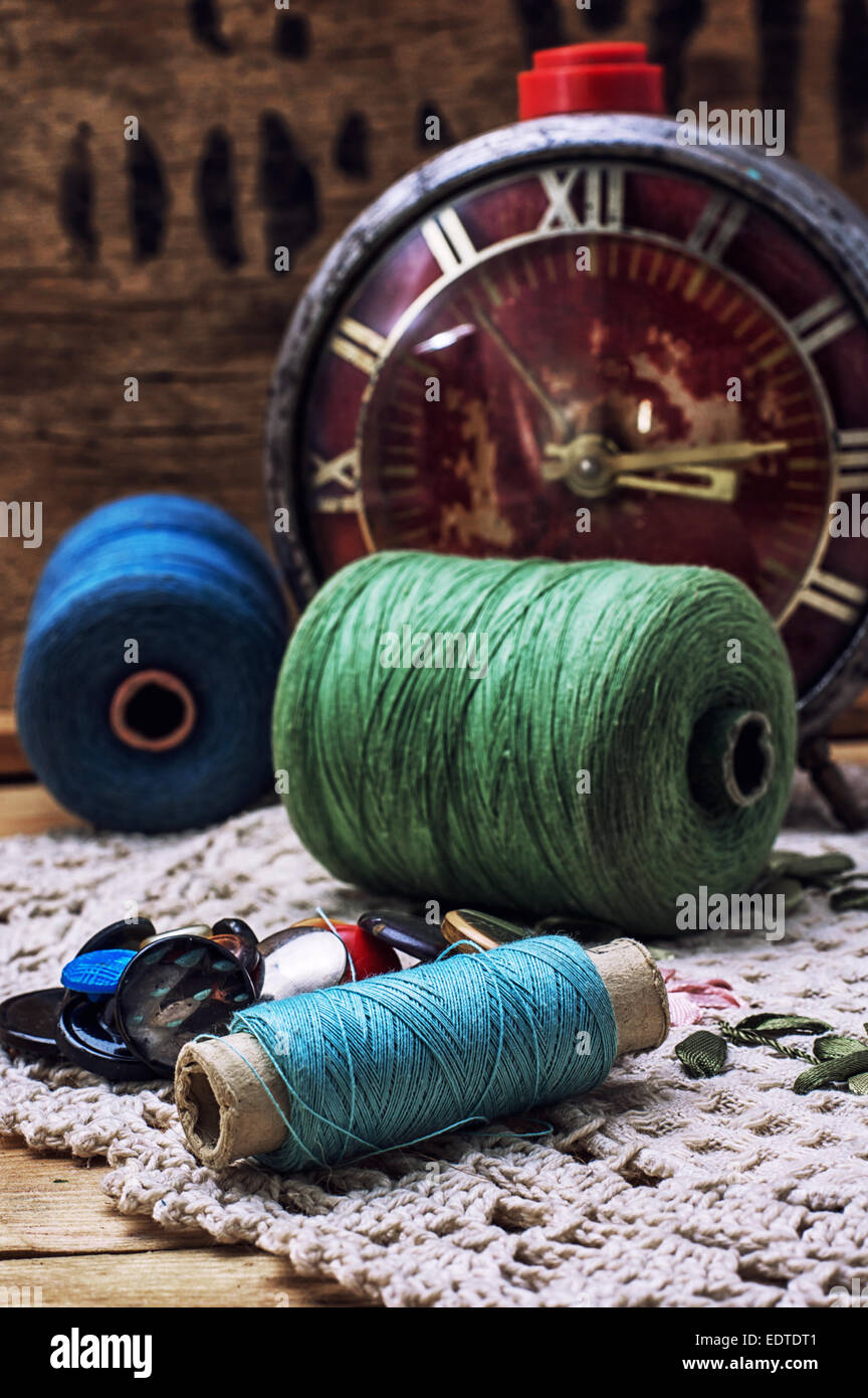 spool sewing thread and buttons in vintage style Stock Photo - Alamy